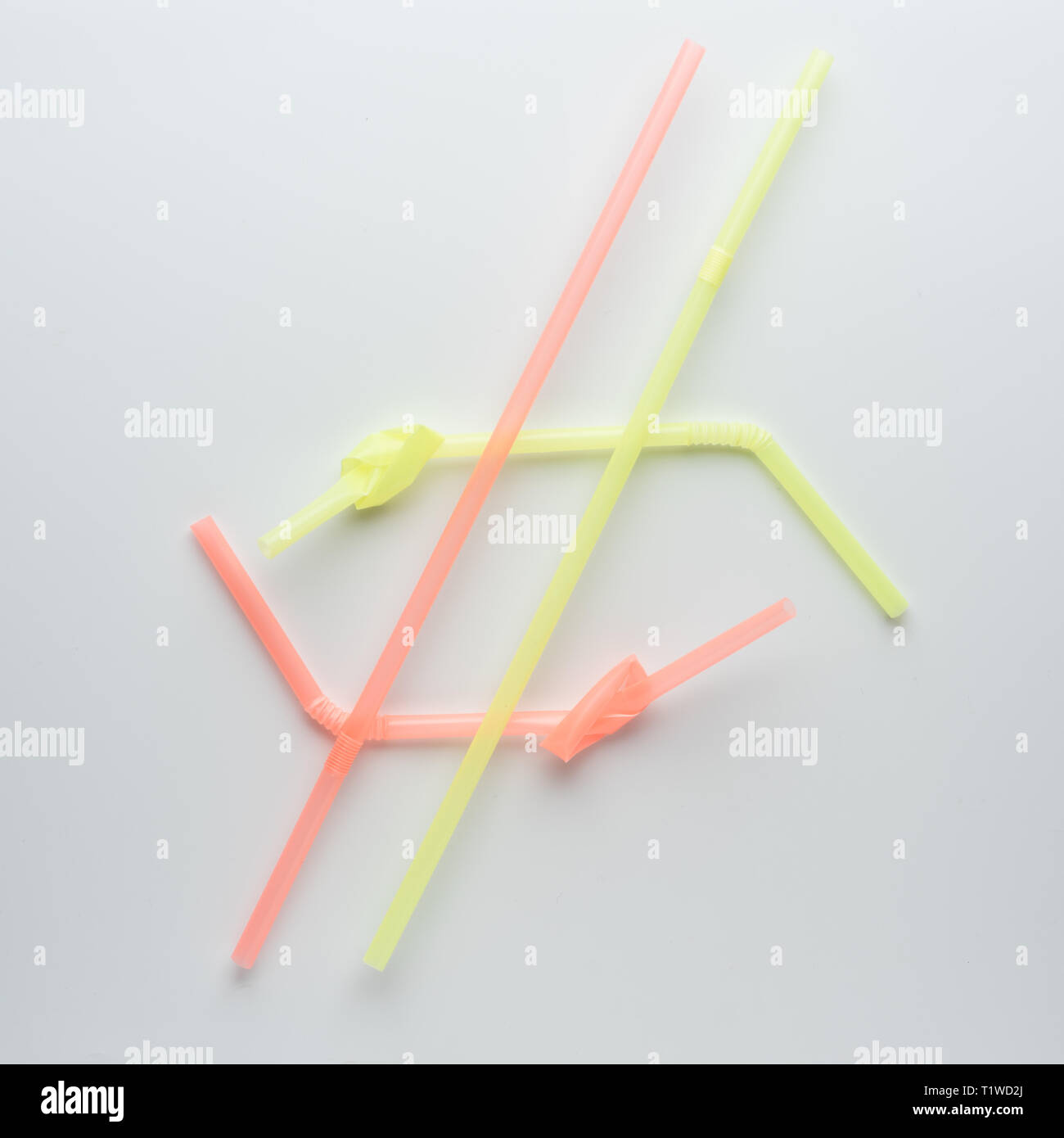 Disposable plastic knotted drinking straw. Conceptual photo about ...