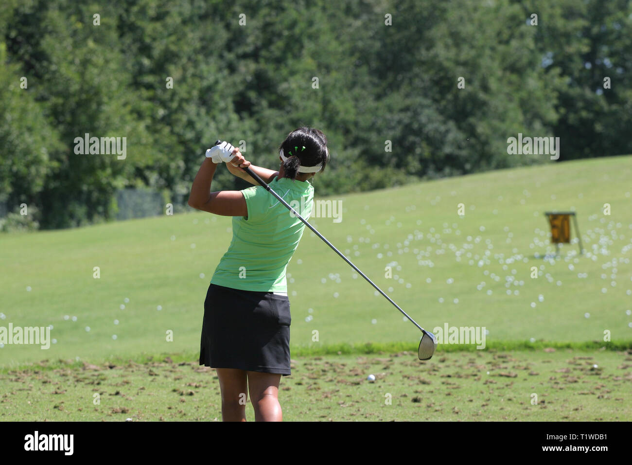 Lady golf swing Stock Photo - Alamy