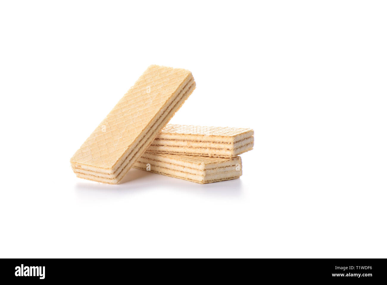 Multi-layered waffles with white creamy filling isolated on white ...