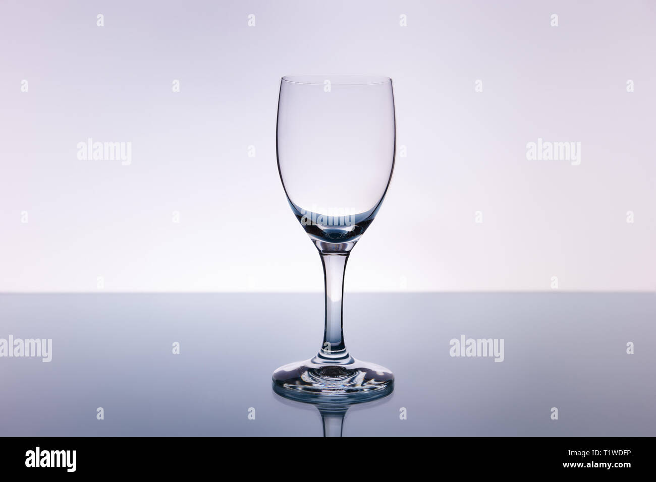 wine glass a reflection on a light background, backlighting Stock Photo ...