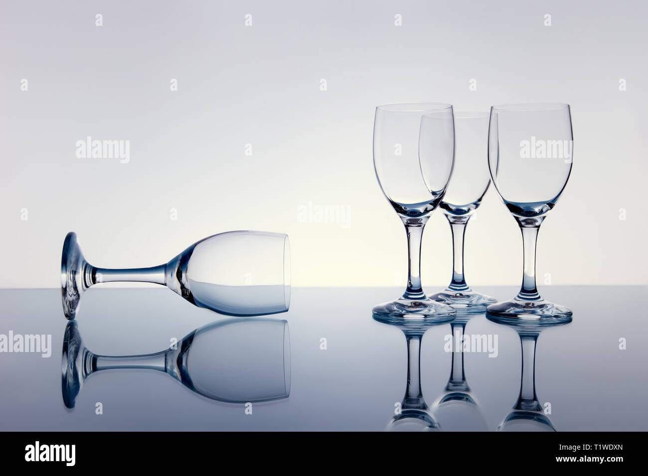 wine glass a reflection on a light background, backlighting Stock Photo ...