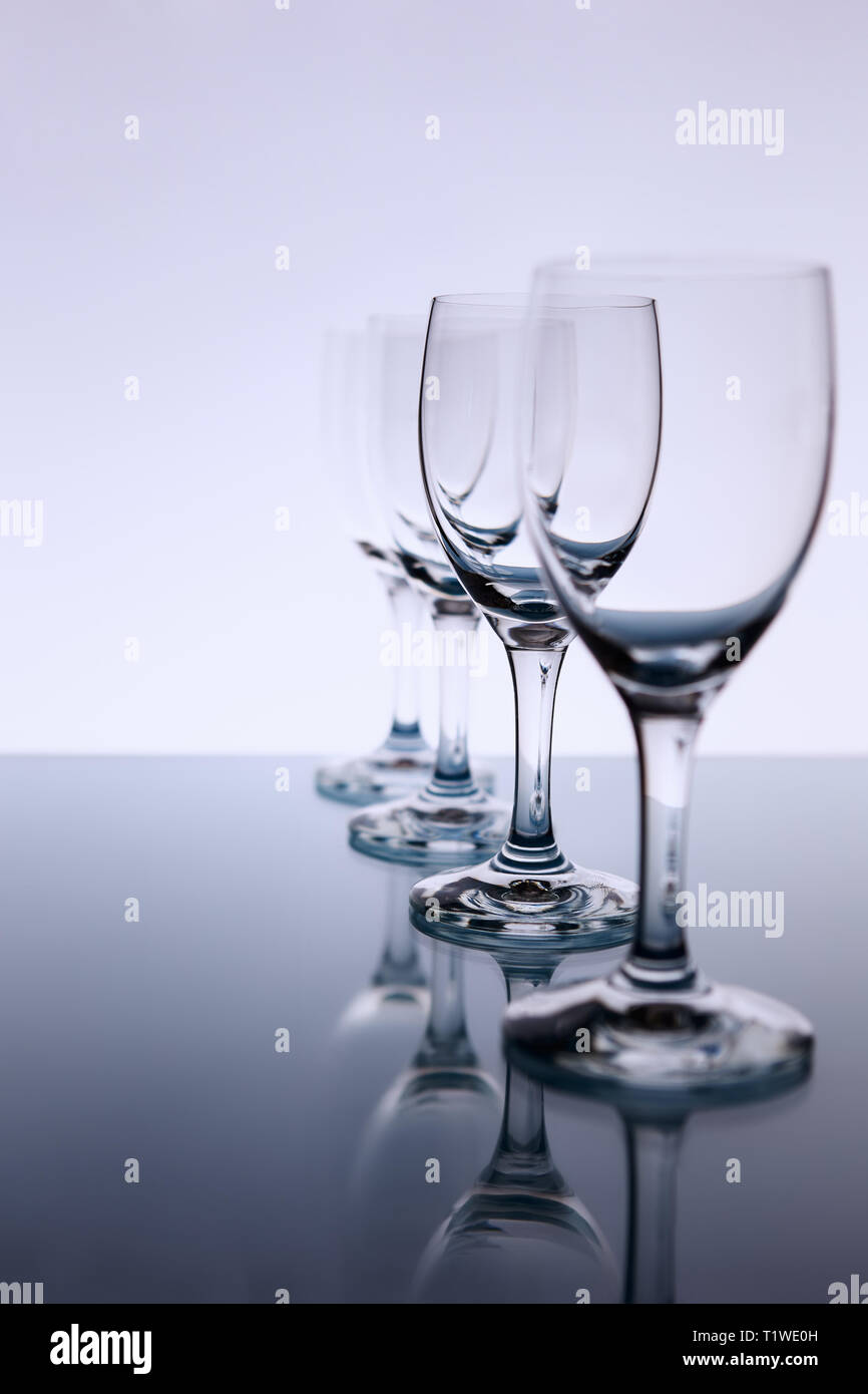 wine glass a reflection on a light background, backlighting Stock Photo ...