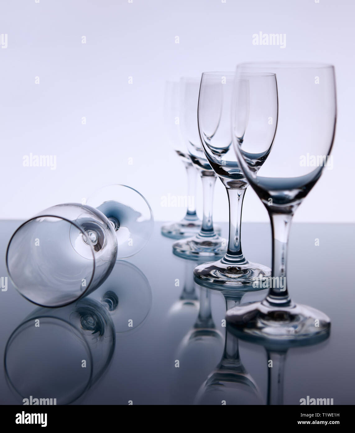 wine glass a reflection on a light background, backlighting Stock Photo ...