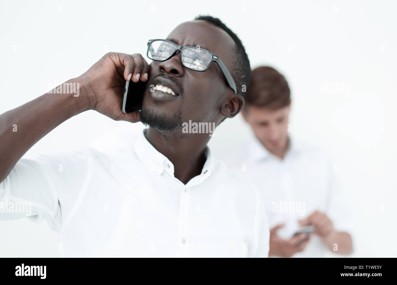 group of young people looking at the screens of their smartphones Stock ...