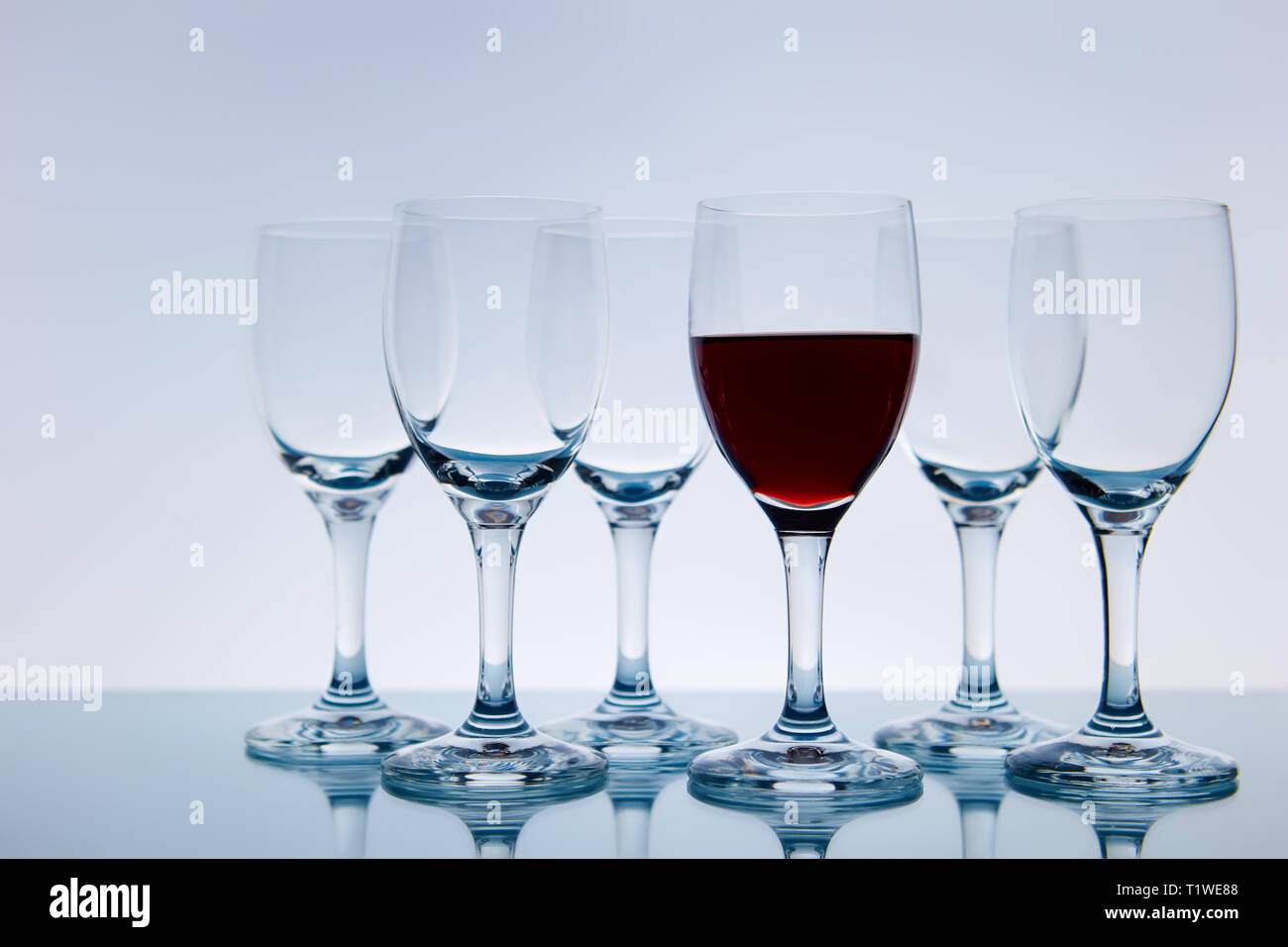 wine glass a reflection on a light background, backlighting Stock Photo ...