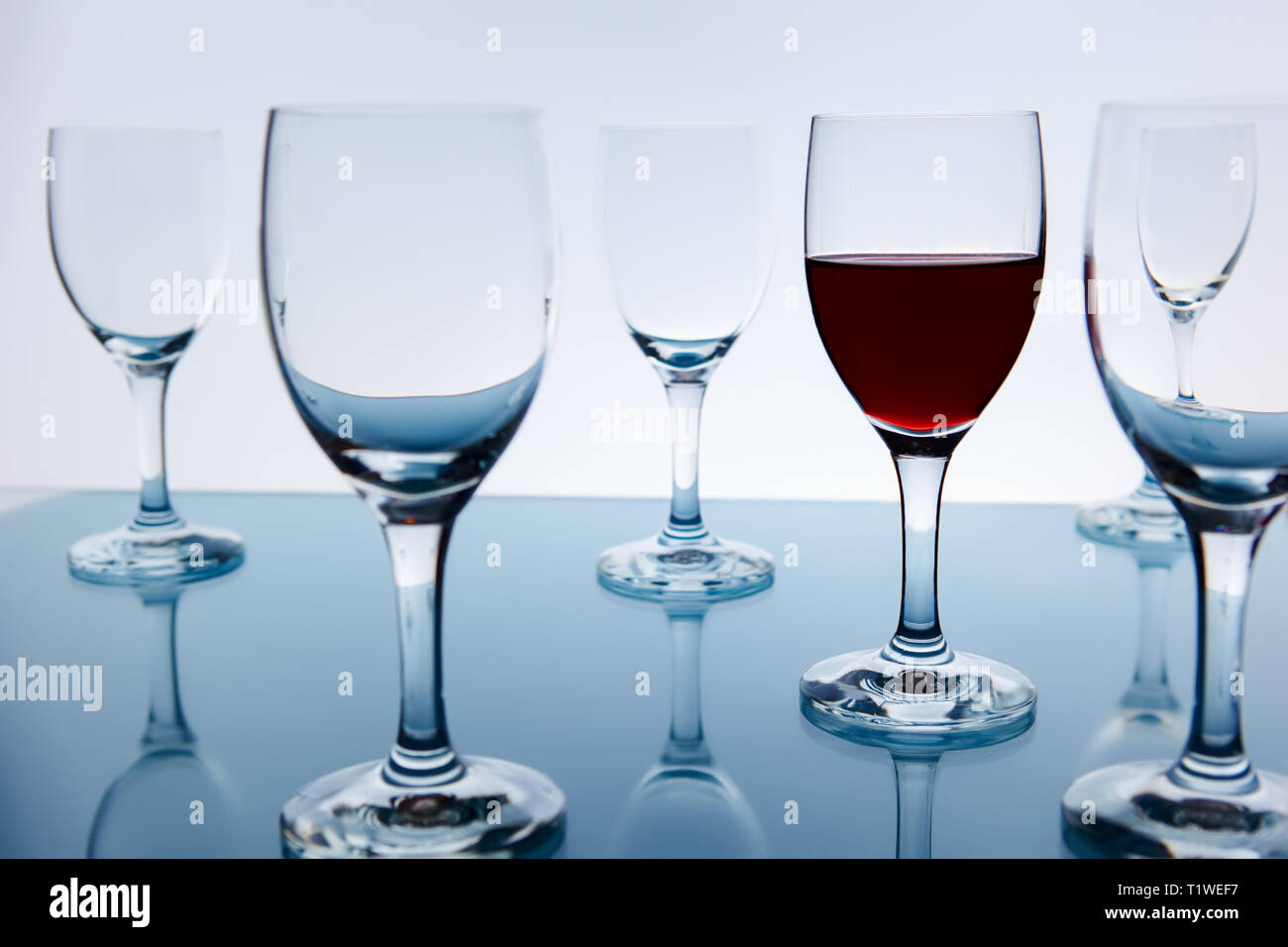 wine glass a reflection on a light background, backlighting Stock Photo ...