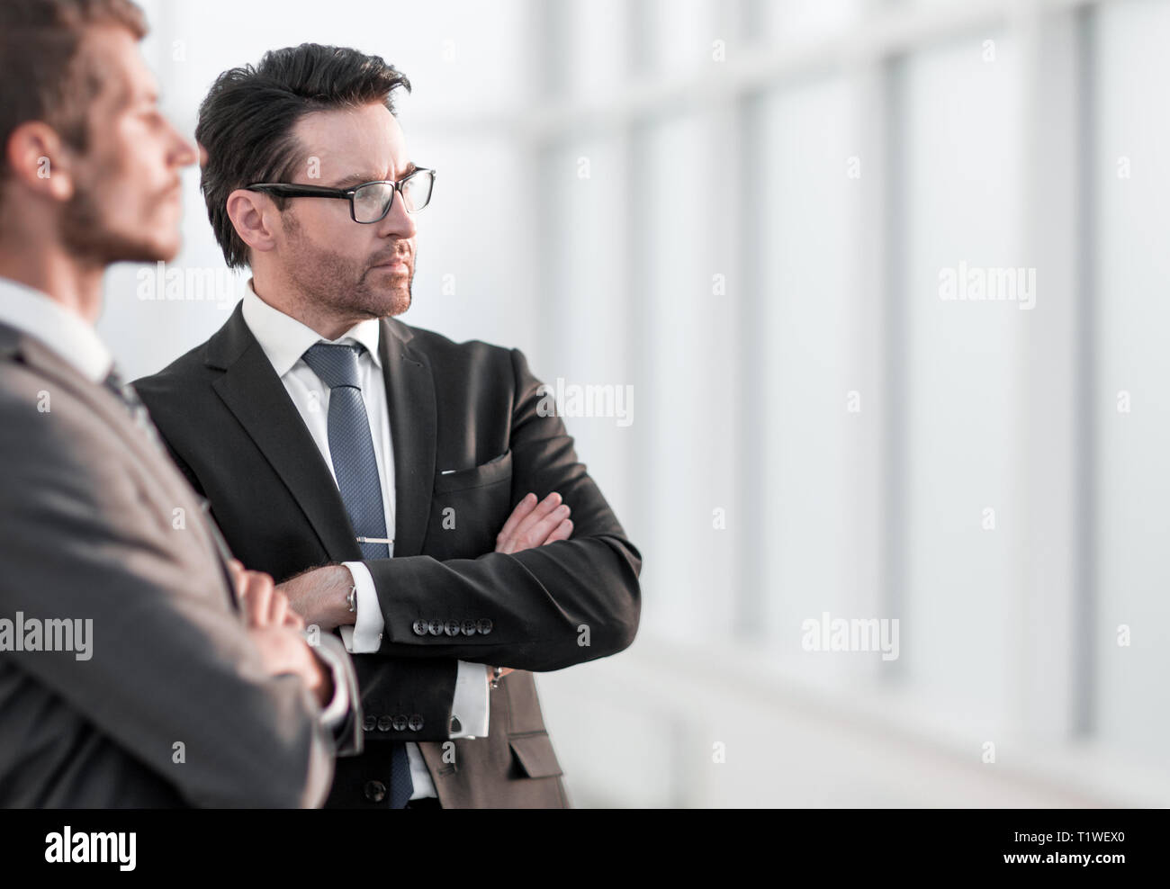 business partners talking near the office window Stock Photo - Alamy