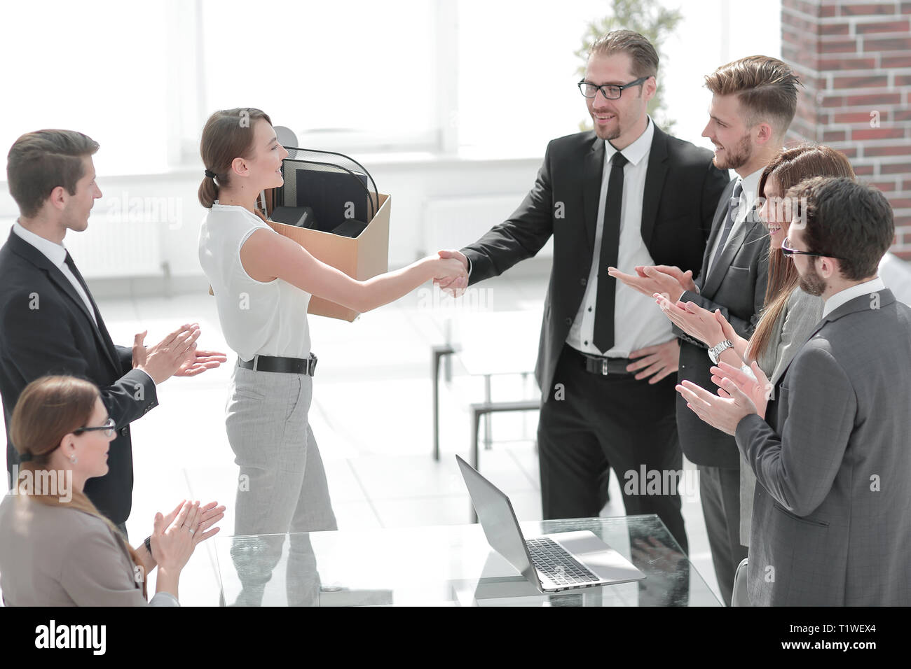 boss and the new employee shaking hands with each other Stock Photo - Alamy