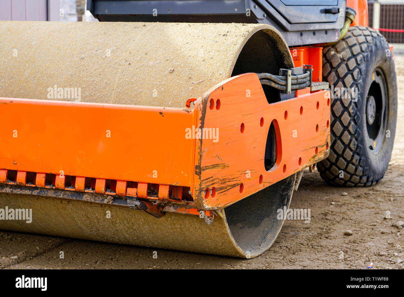 the road roller works on the construction site of a new building Stock ...