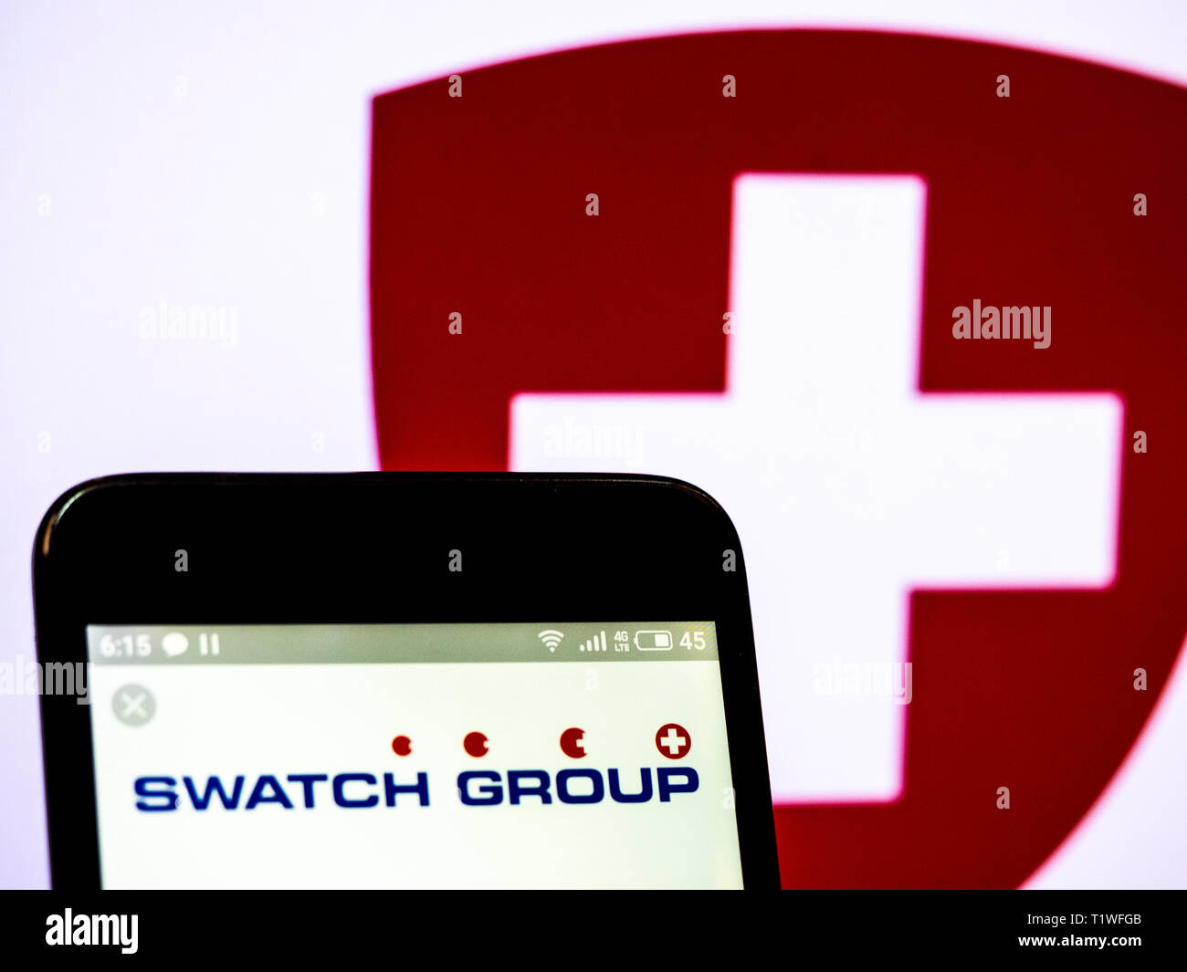 In this photo illustration The Swatch Group AG logo seen displayed on a ...
