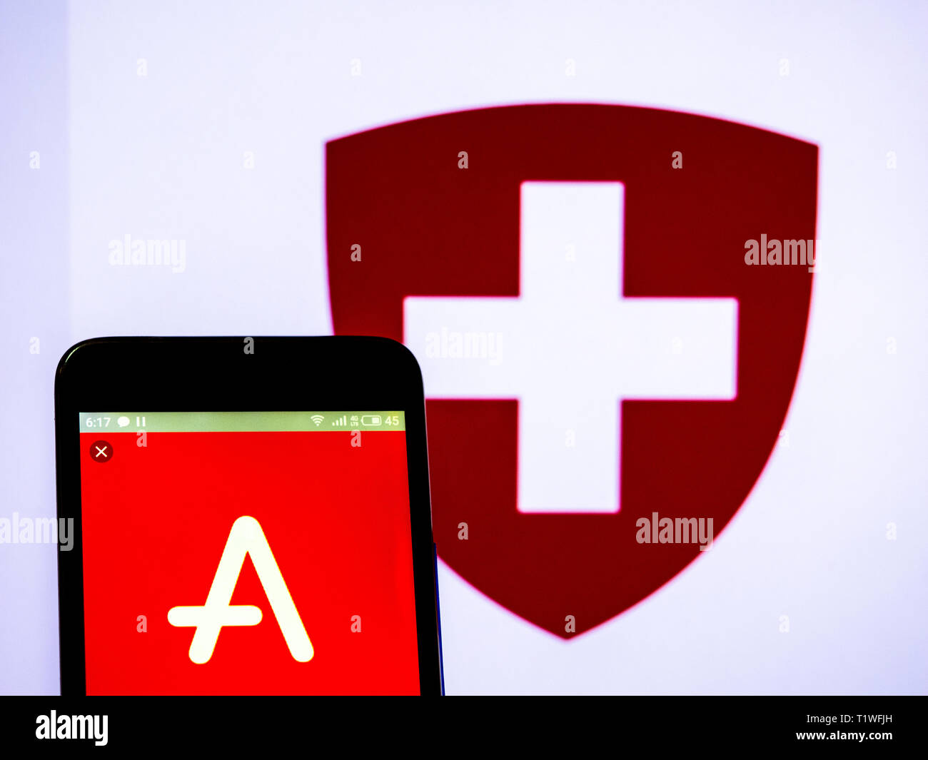 In this photo illustration The Adecco Group logo seen displayed on a ...