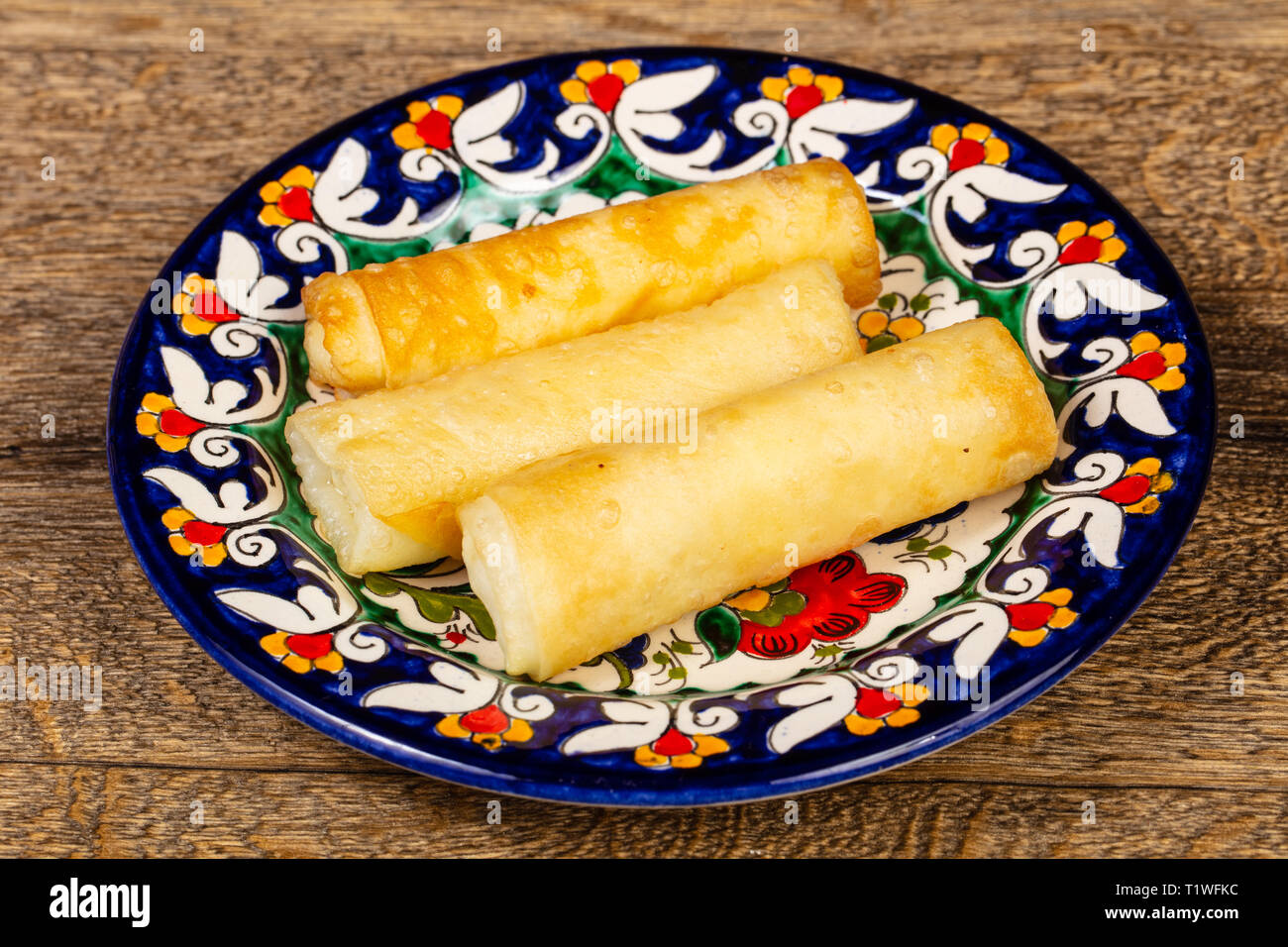Roasted hot stuffed spring roll Stock Photo - Alamy