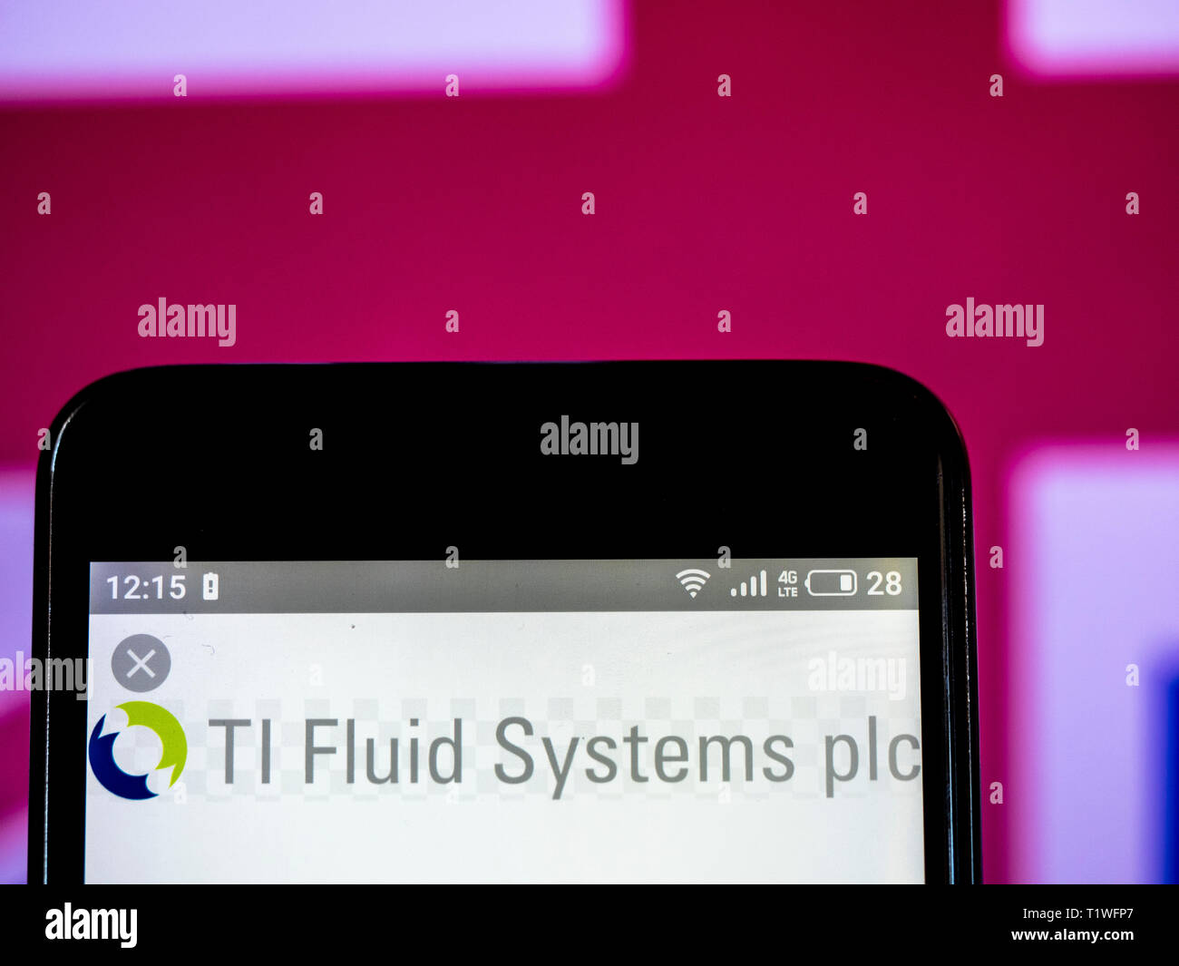 In this photo illustration a TI Fluid Systems logo seen displayed on a ...