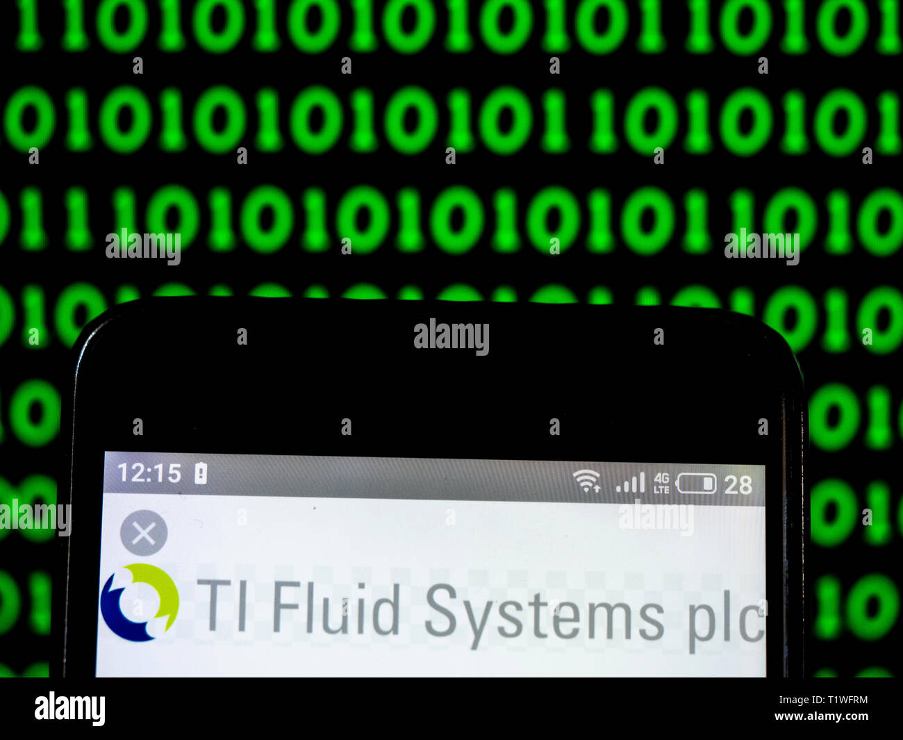 In this photo illustration a TI Fluid Systems logo seen displayed on a ...