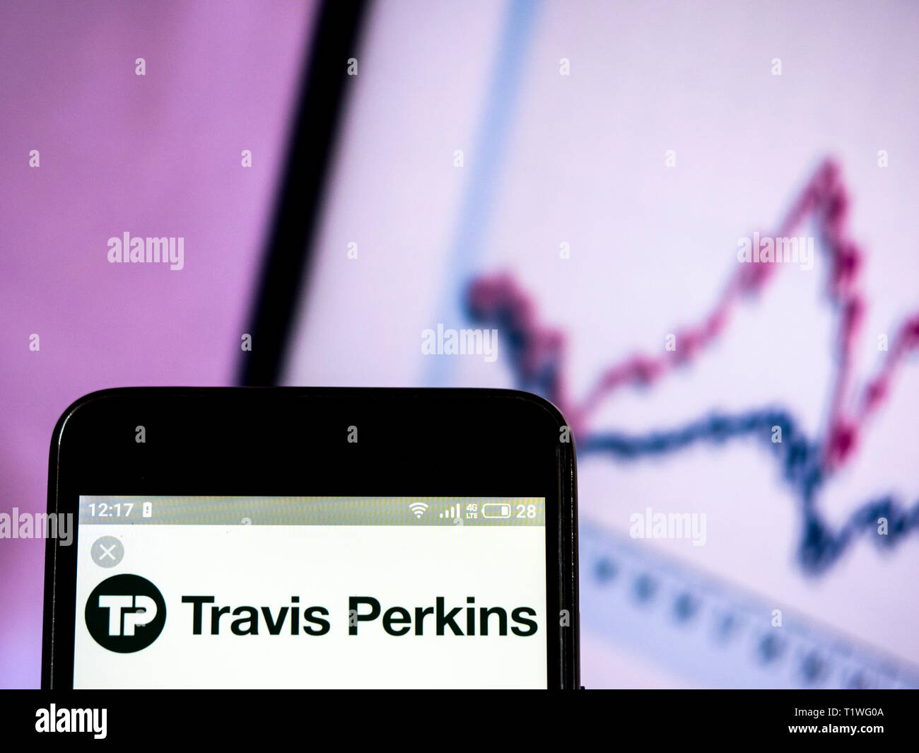 In this photo illustration a Travis Perkins plc logo seen displayed on a smart phone Stock Photo ...