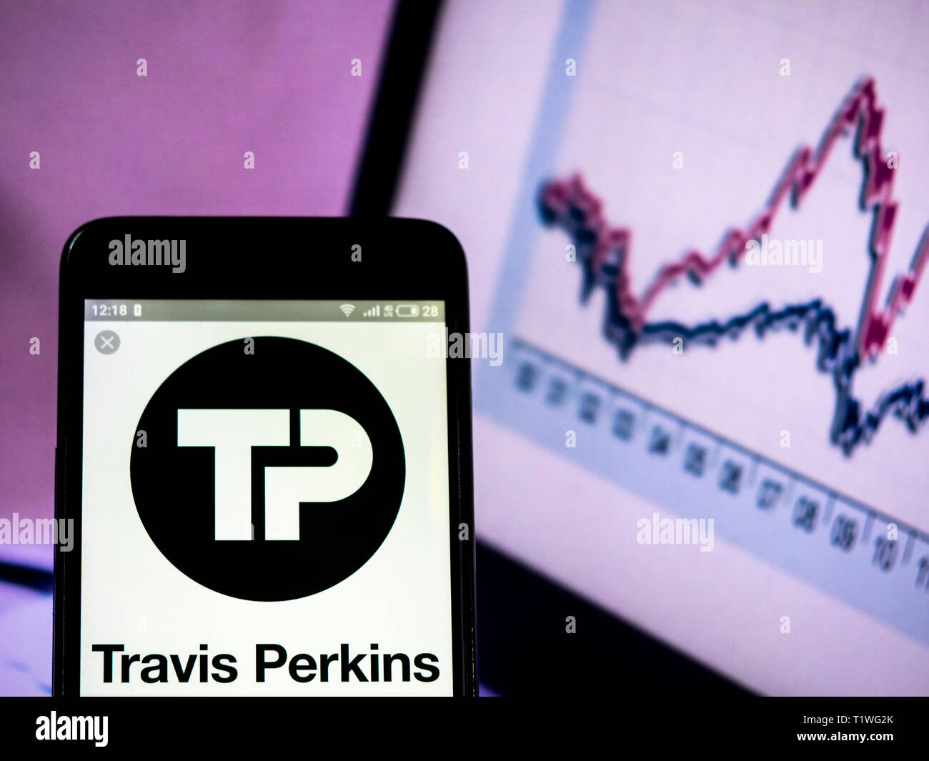 In this photo illustration a Travis Perkins plc logo seen displayed on a smart phone Stock Photo ...