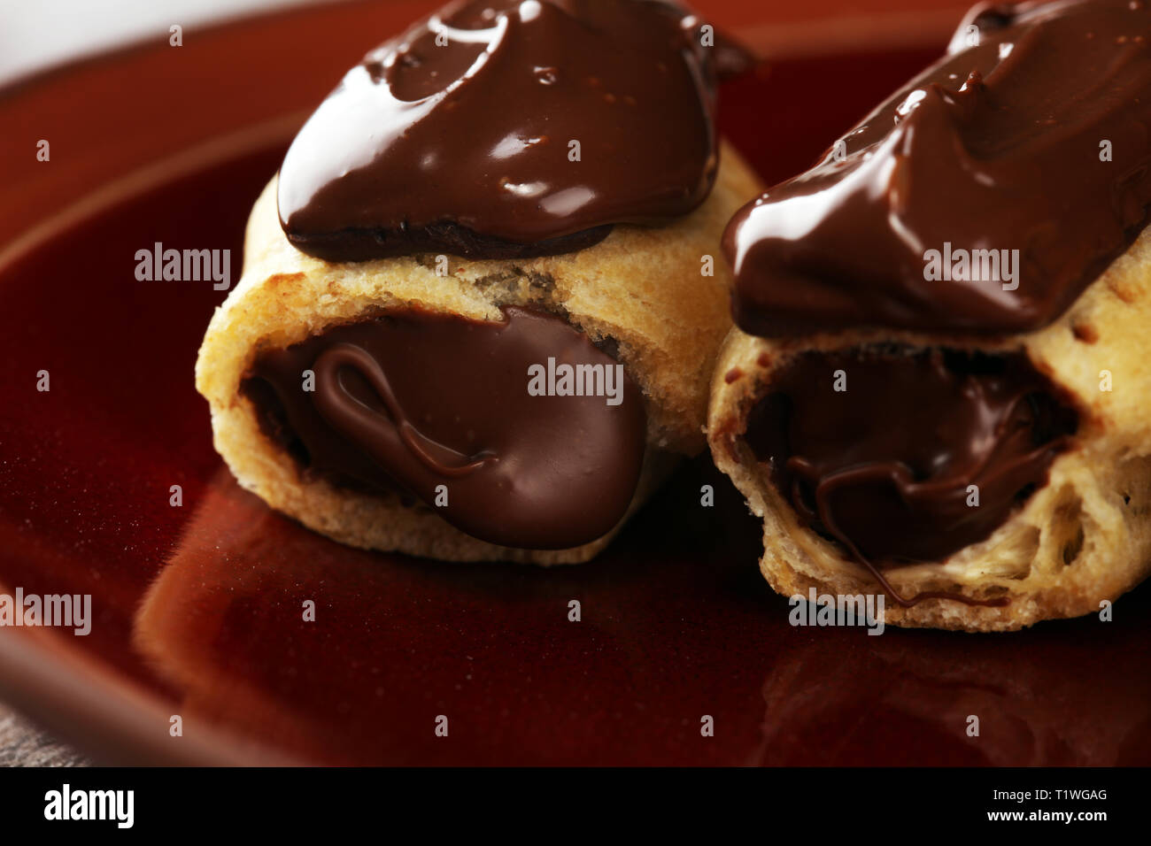 Traditional French dessert. Eclair with chocolate icing. Pastery ...