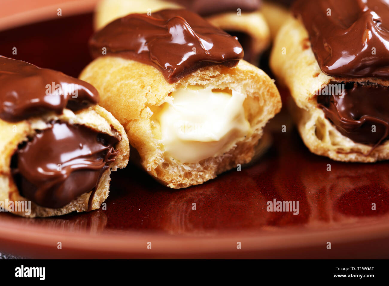 Traditional French dessert. Eclair with chocolate icing. Pastery ...