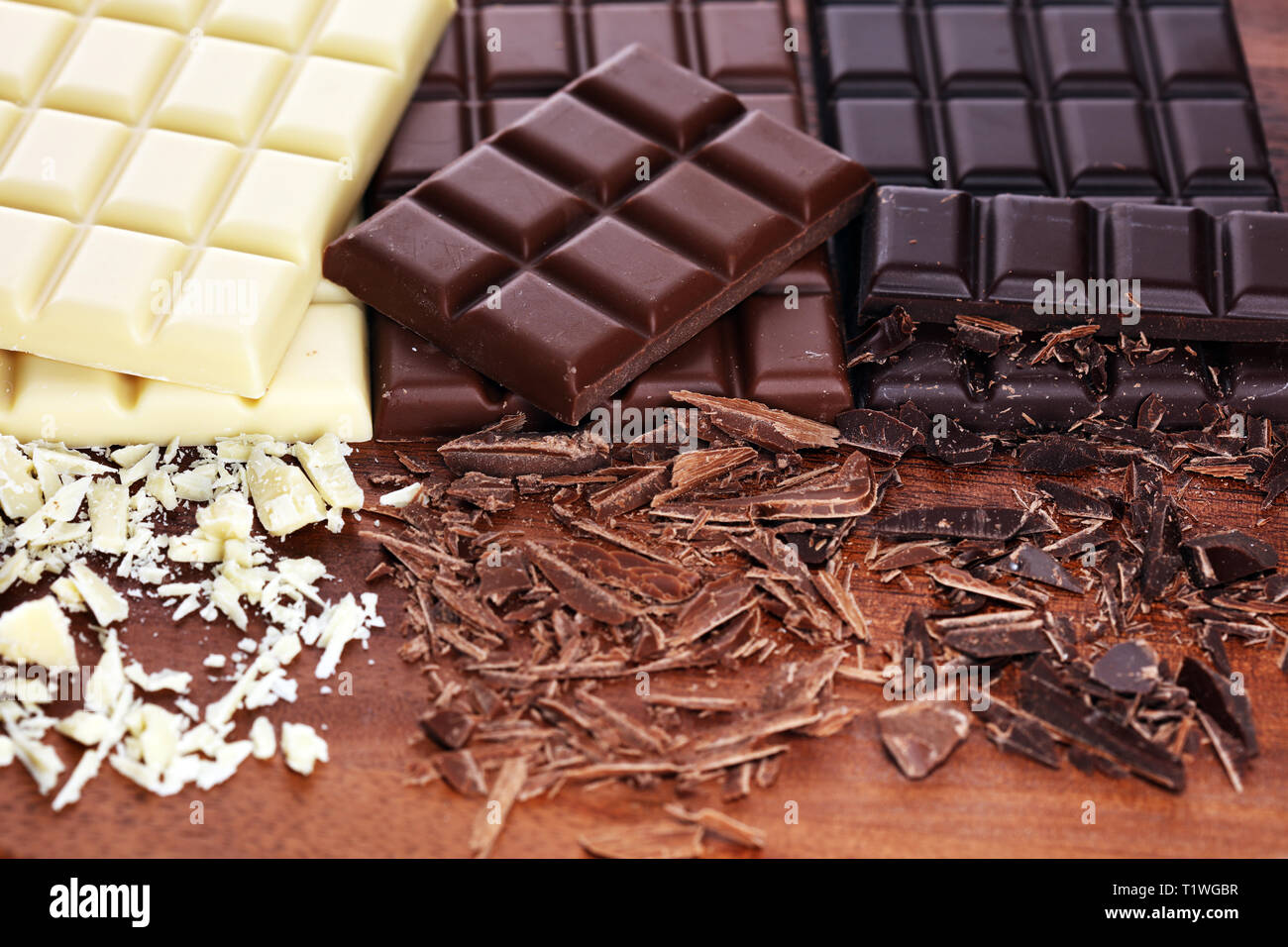 chocolate in diffrent color. milk, dark and white chocolate bars and ...