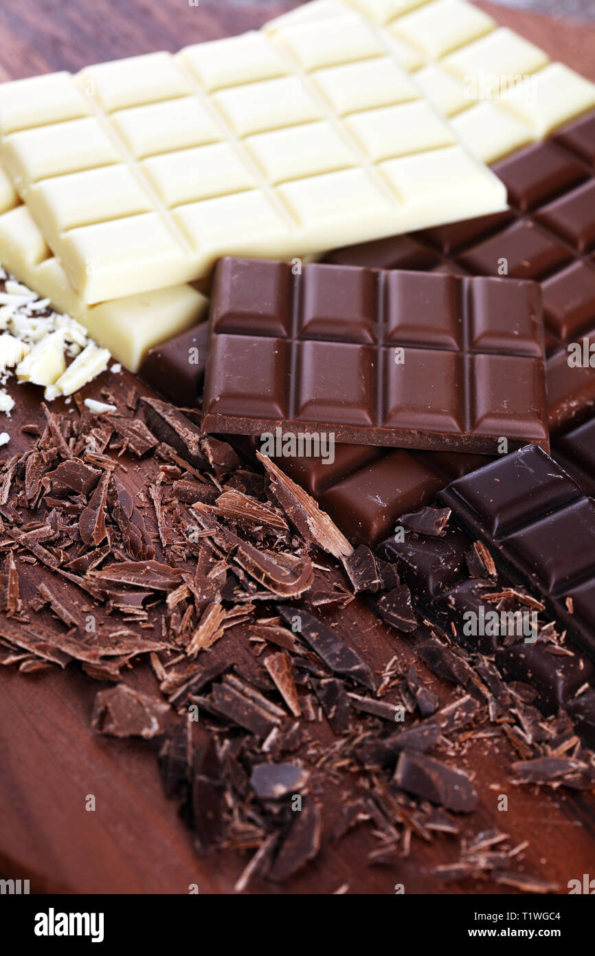 chocolate in diffrent color. milk, dark and white chocolate bars and ...