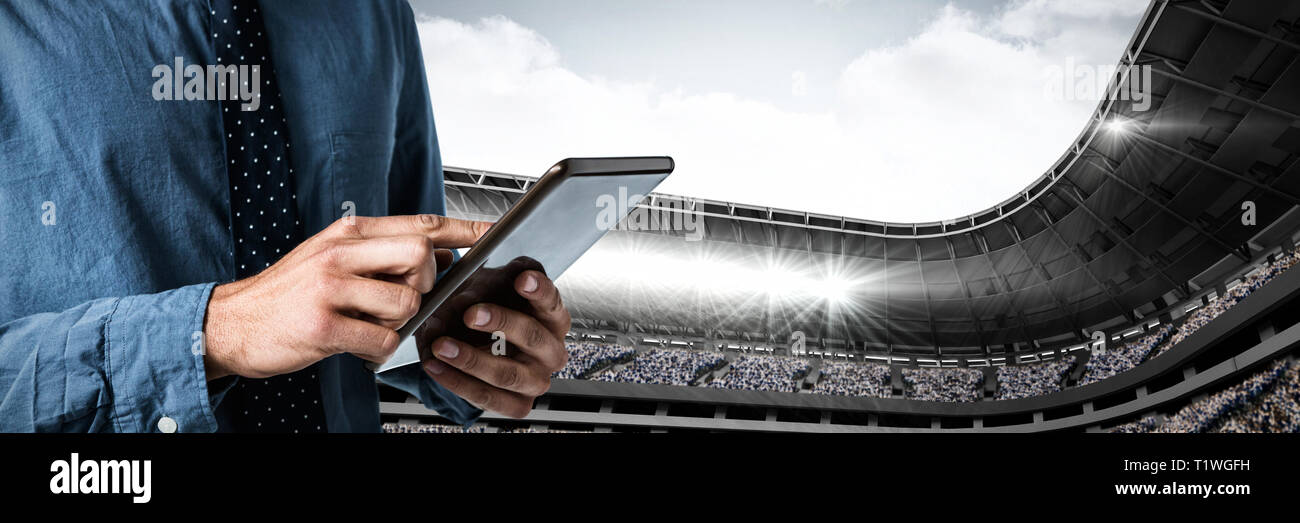 Composite image of mid-section of business man using a tablet Stock ...