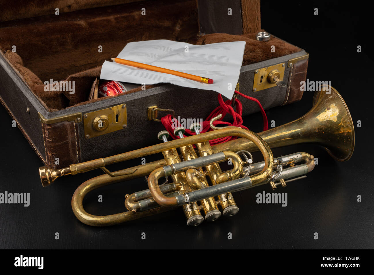 Old covered patina trumpet in a case. A historic wind musical ...