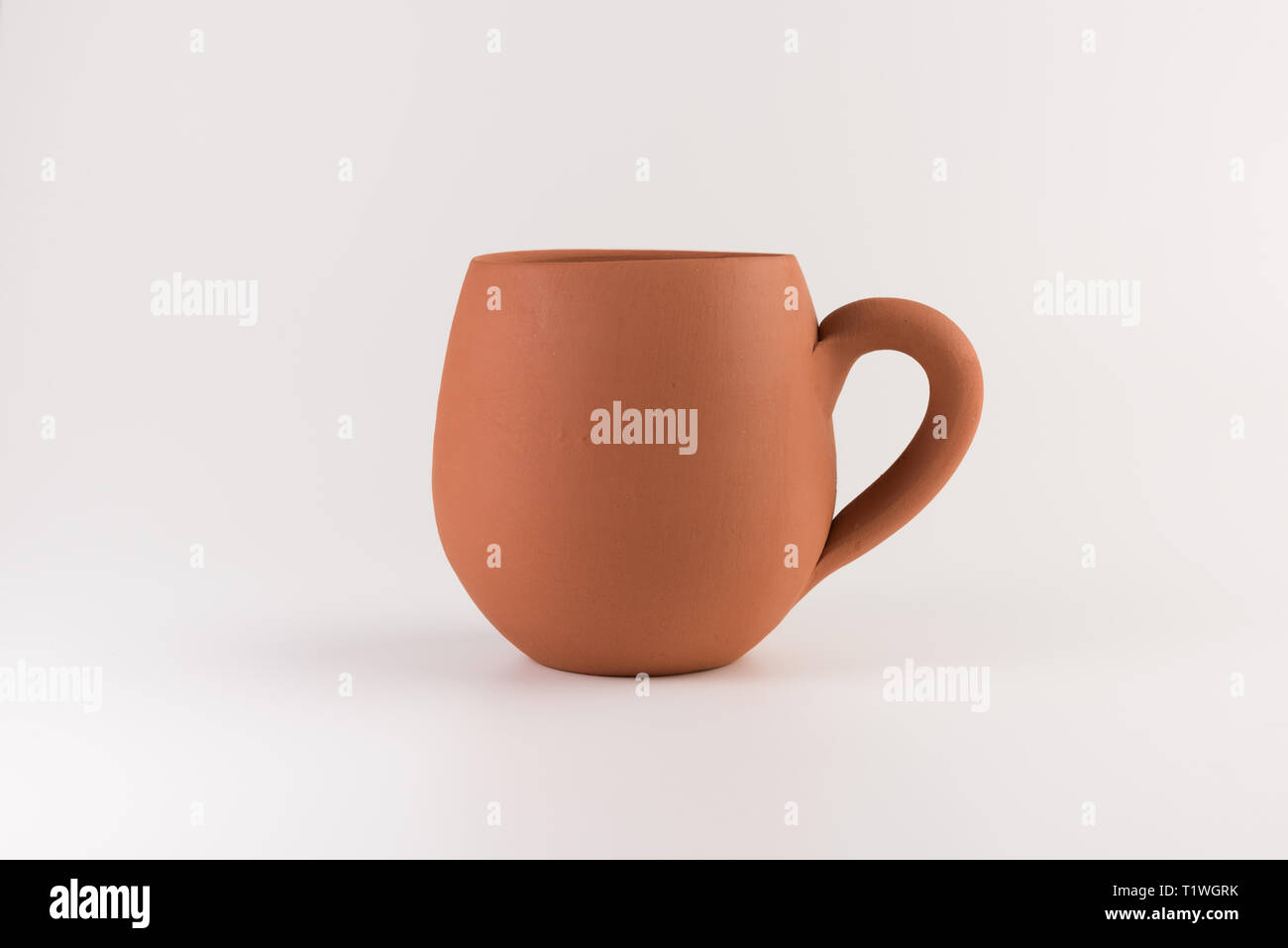 Empty unpainted clay pot isolated on white Stock Photo - Alamy