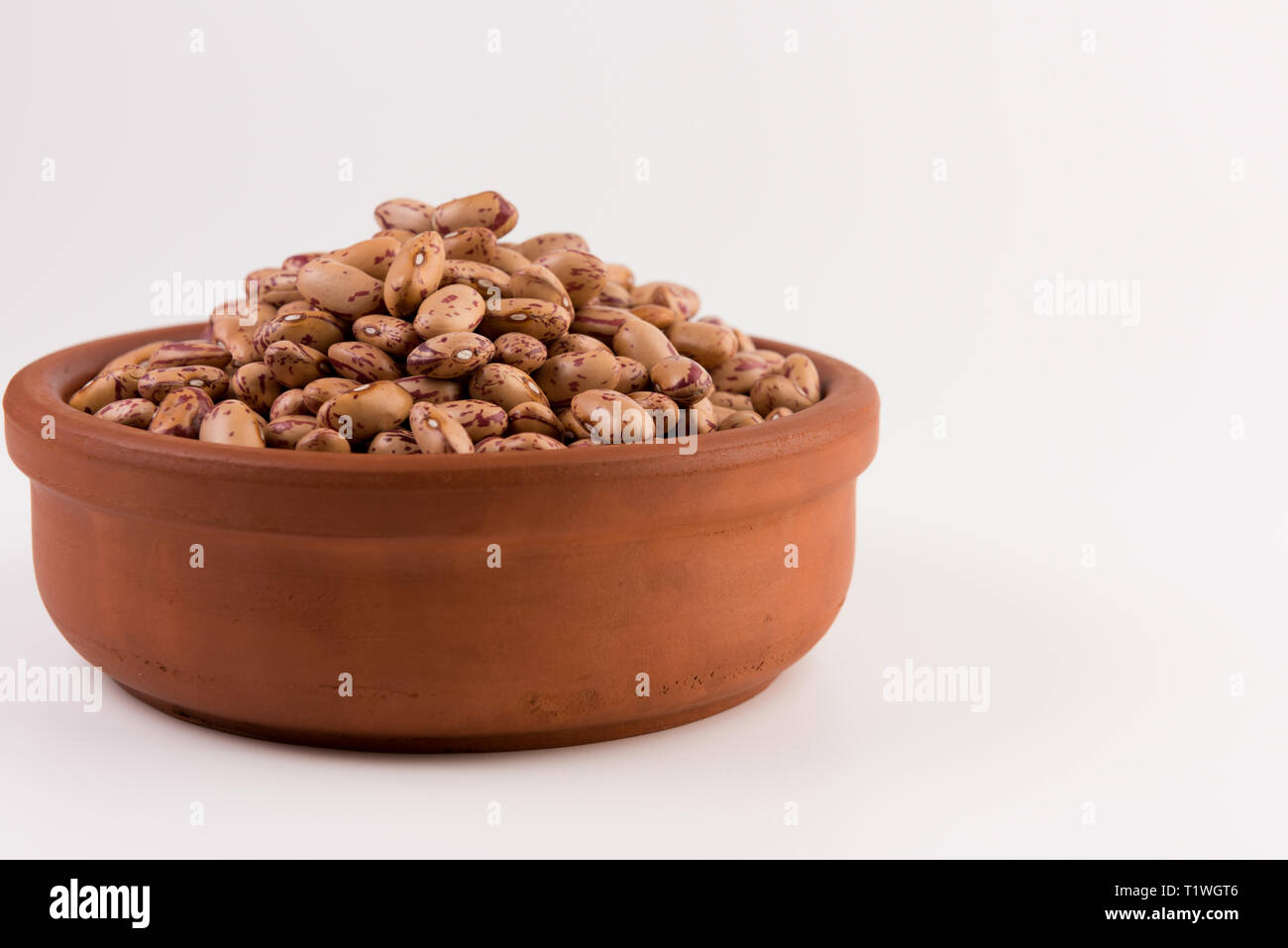 A plate of beans on white background Stock Photo - Alamy