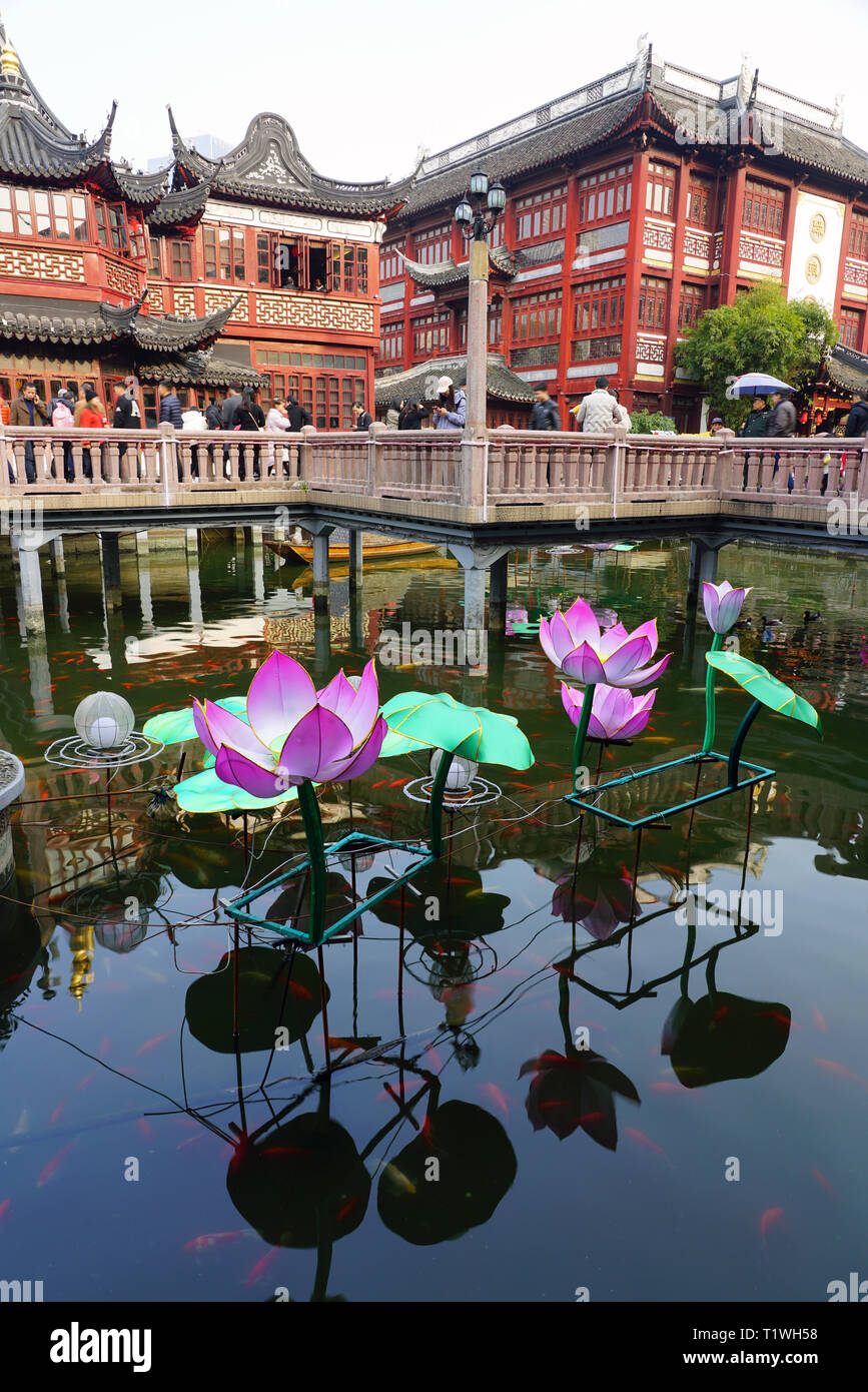 SHANGHAI, CHINA -4 MAR 2019- View of the Jiuqu Bridge and koi pond at ...