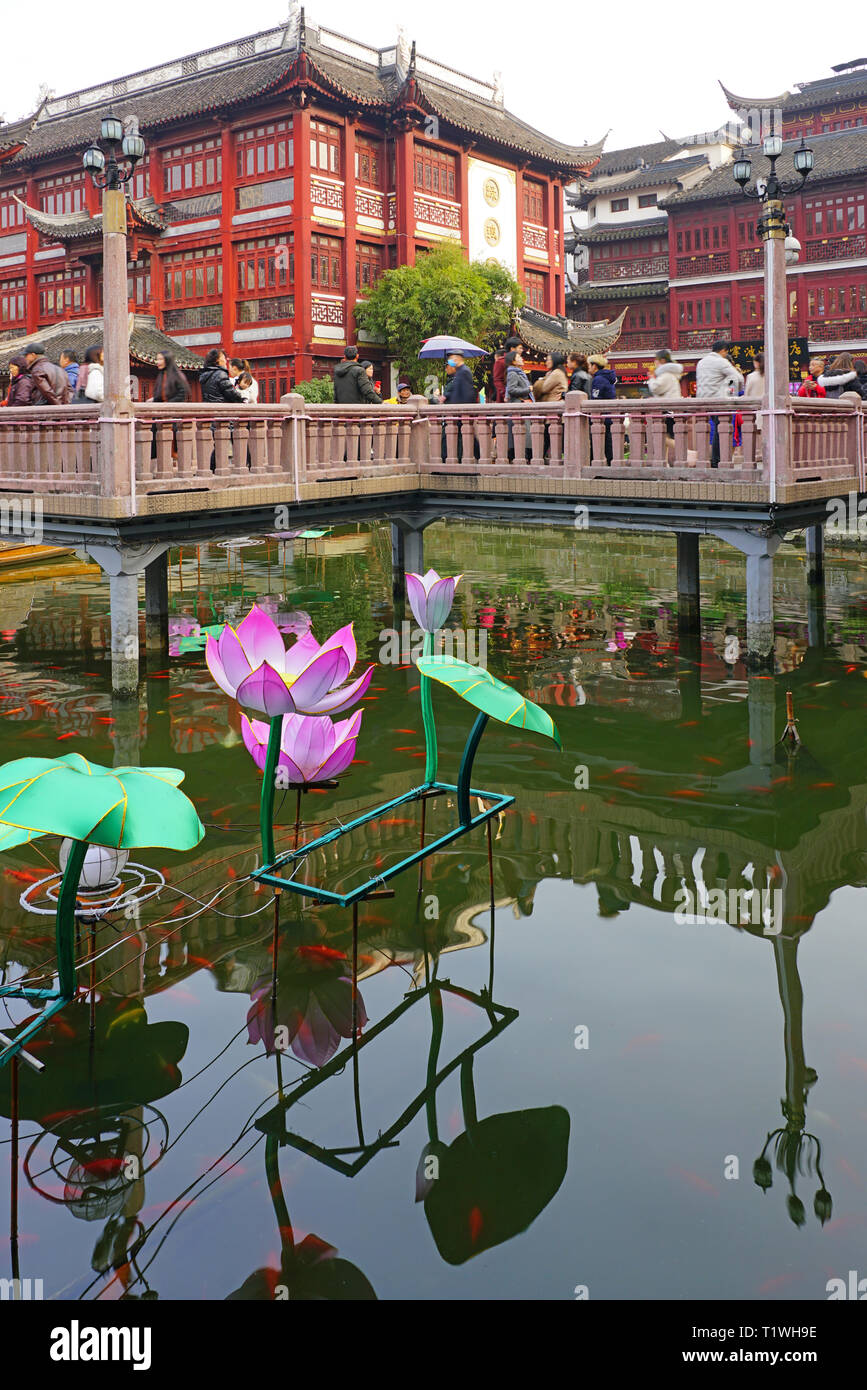 SHANGHAI, CHINA -4 MAR 2019- View of the Jiuqu Bridge and koi pond at ...