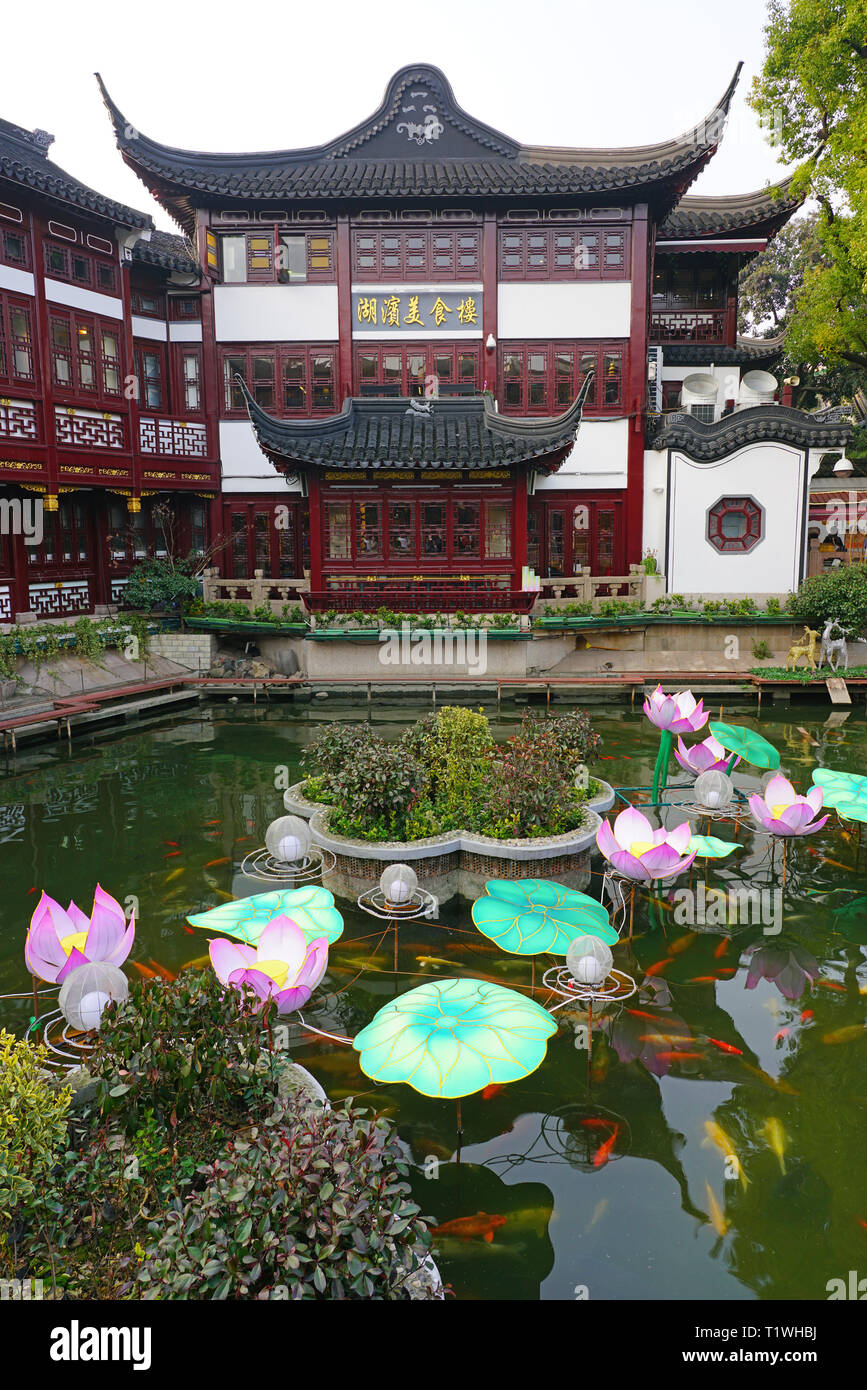 SHANGHAI, CHINA -4 MAR 2019- View of the Jiuqu Bridge and koi pond at ...