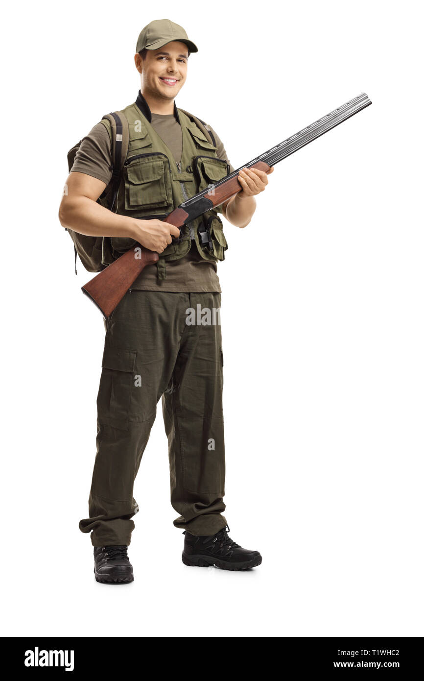 Full length portrait of a hunter posing with a shotgun isolated on ...