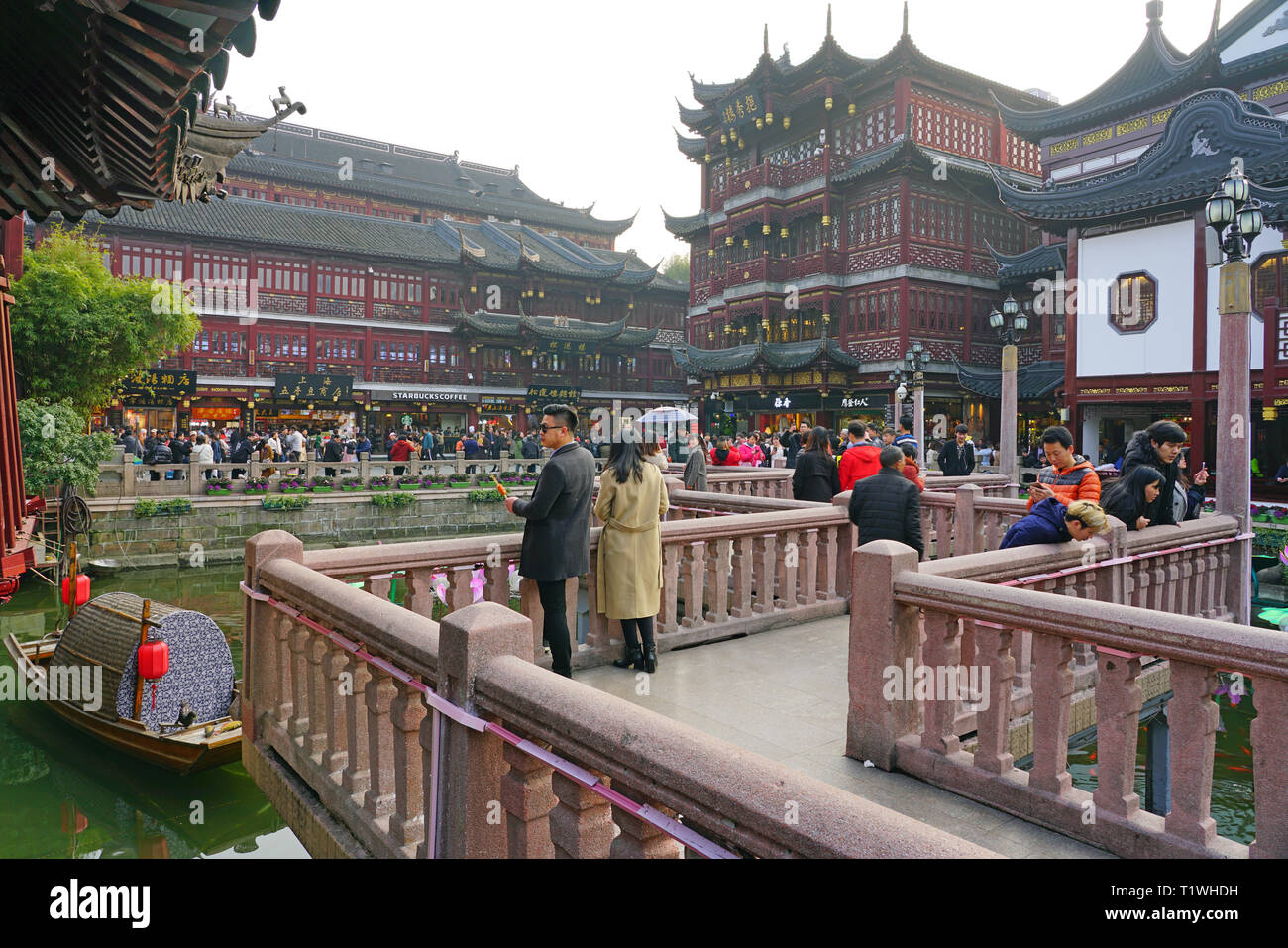 SHANGHAI, CHINA -4 MAR 2019- View of the Jiuqu Bridge and koi pond at ...