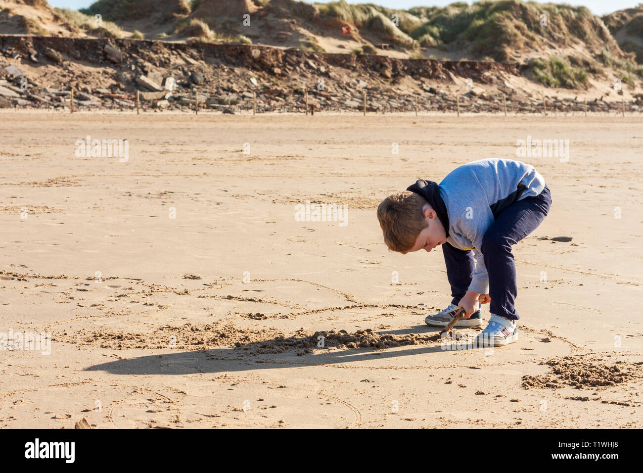 Stick Drawing In The Sand High Resolution Stock Photography and Images ...