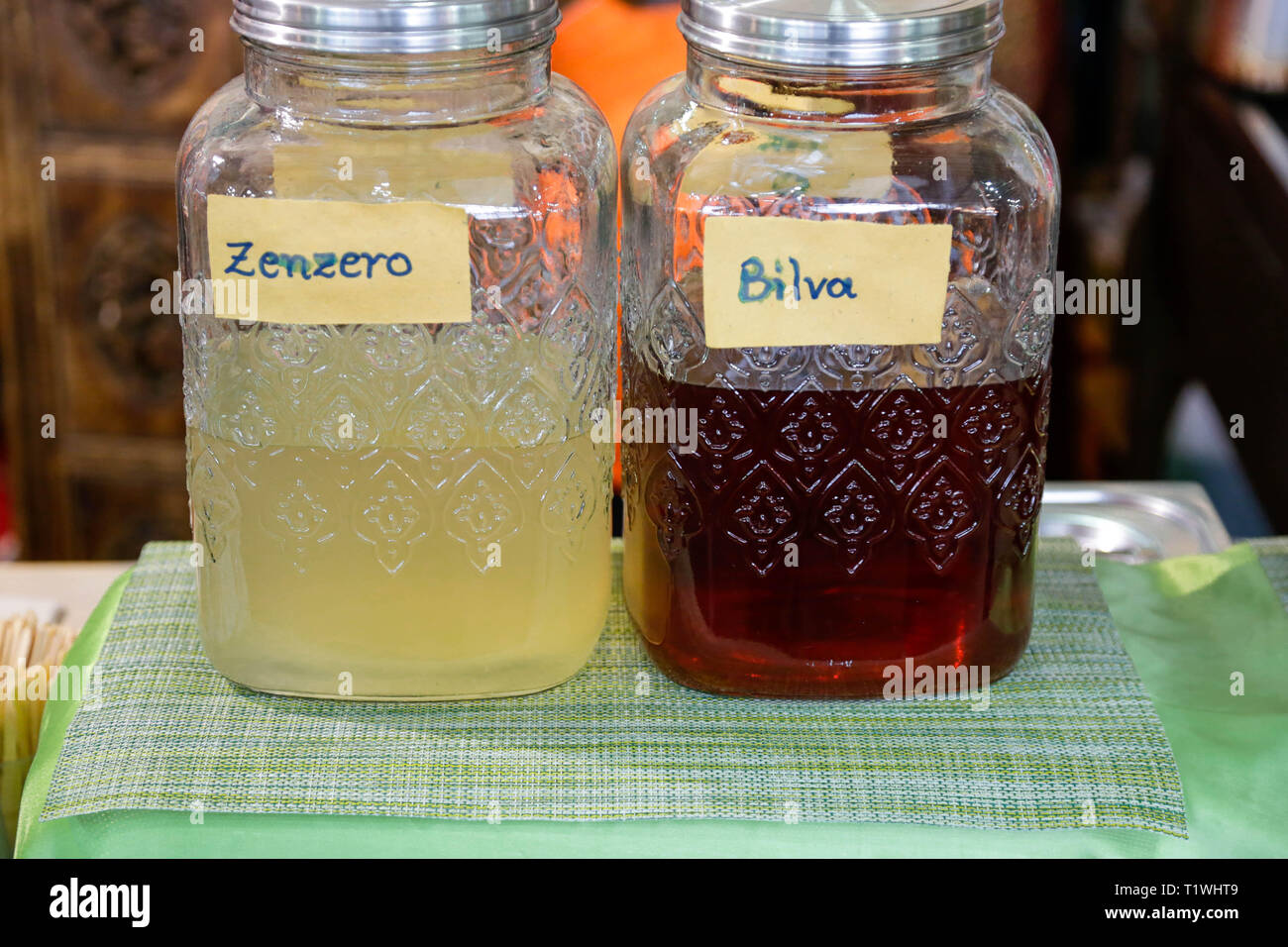 Oriental asian woman, with typical kimono, writes names in Japanese ...
