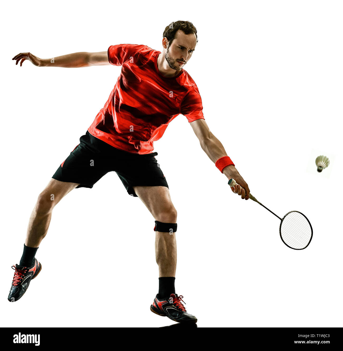 one caucasian Badminton player man in studio shadow silhouette isolated ...