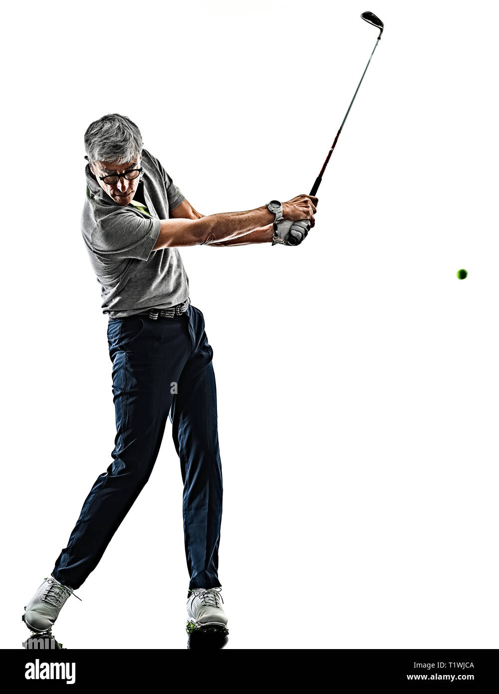 one caucasian senior man golfer golfing in studio shadow silhouette ...