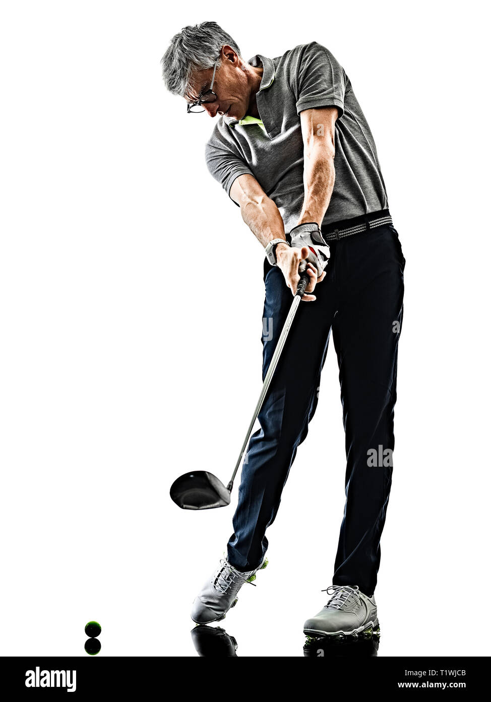 one caucasian senior man golfer golfing in studio shadow silhouette ...