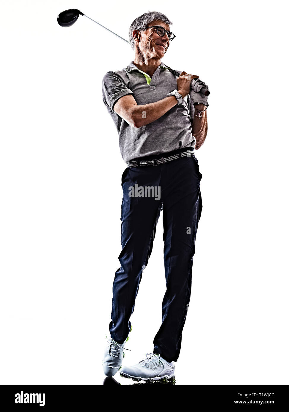 one caucasian senior man golfer golfing in studio shadow silhouette ...