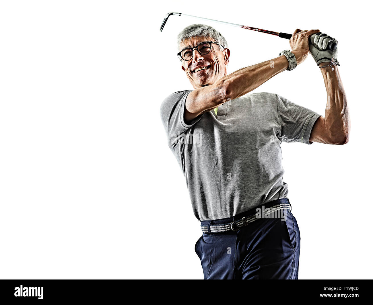 one caucasian senior man golfer golfing in studio shadow silhouette ...