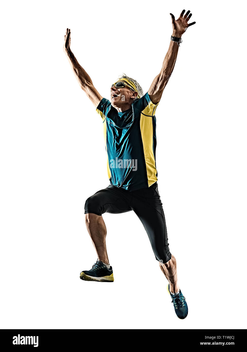 one caucasian senior man running runner jogger jogging in studio shadow ...
