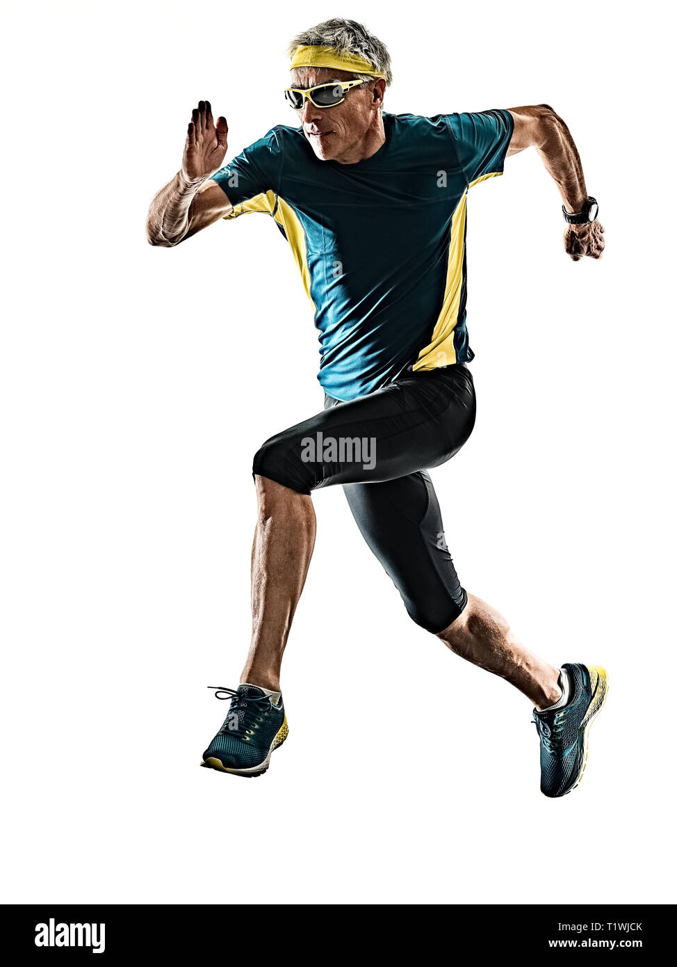 one caucasian senior man running runner jogger jogging in studio shadow ...