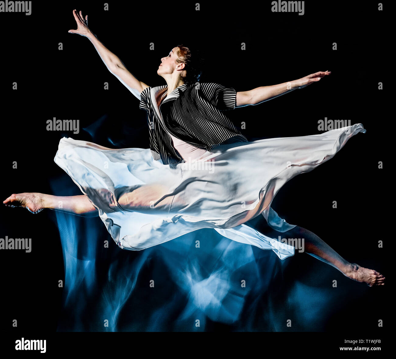 one caucasian woman modern ballet dancer dancing woman studio shot ...