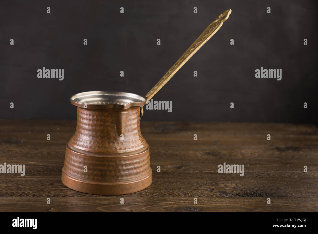 Copper turk with wooden handle hi-res stock photography and images - Alamy