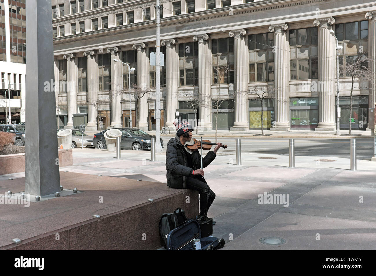 Seated violin busker outdoors hi-res stock photography and images - Alamy