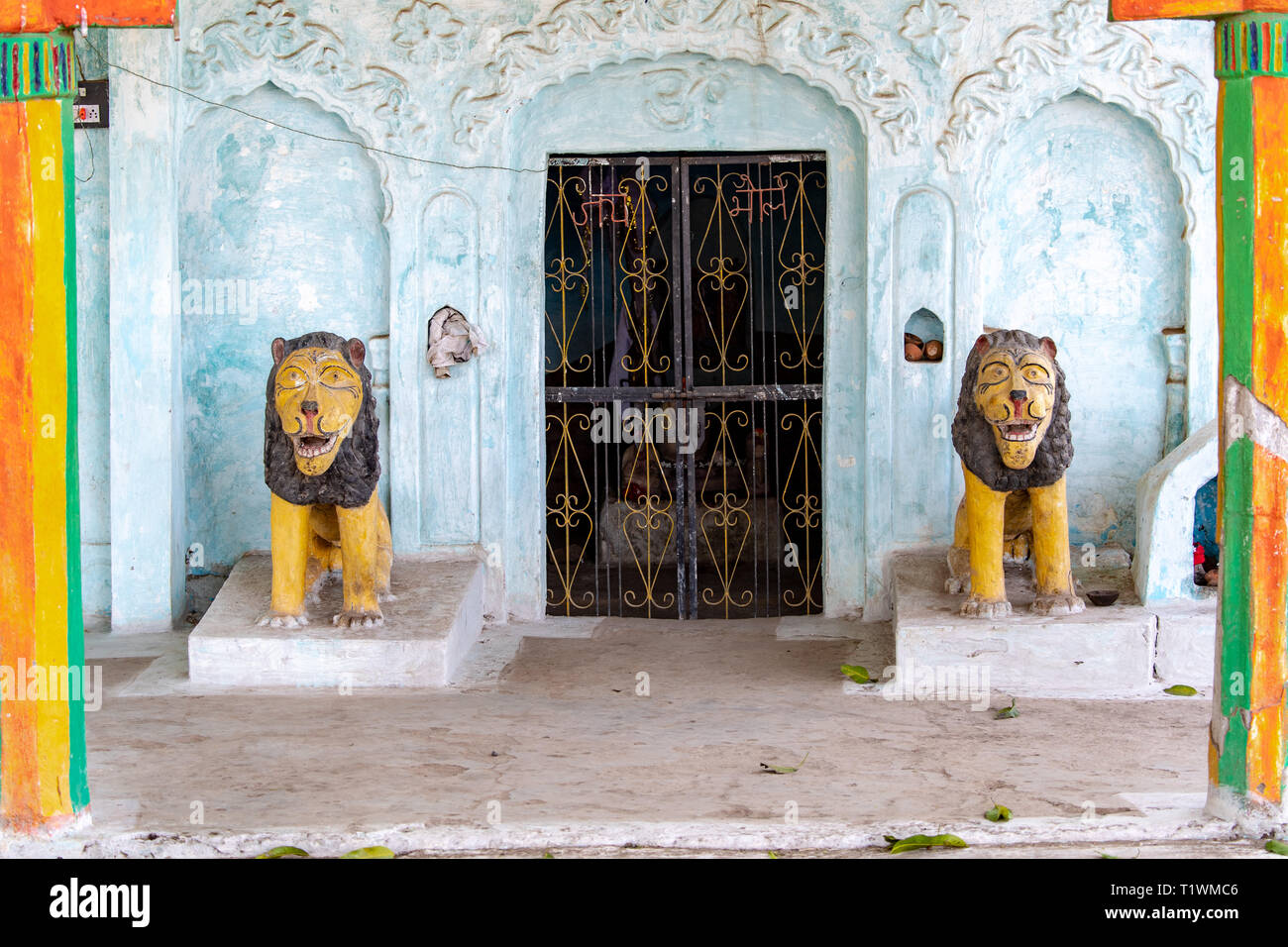 A variety of Hindu deities are carved and colorfully painted on the ...