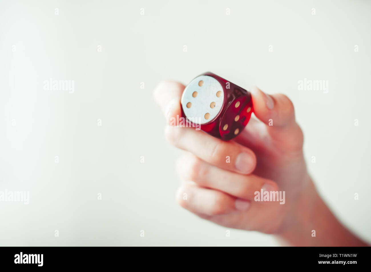 Hand throwing red dices, good luck concept Stock Photo - Alamy