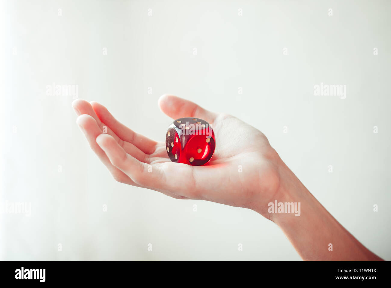Hand throwing red dices, good luck concept Stock Photo - Alamy