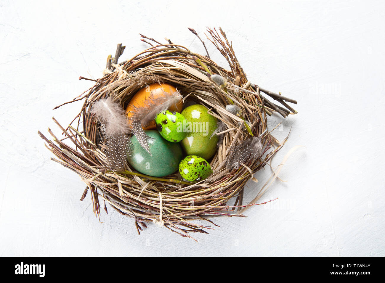 Easter eggs in bird nest. Happy Easter. Top view Stock Photo - Alamy