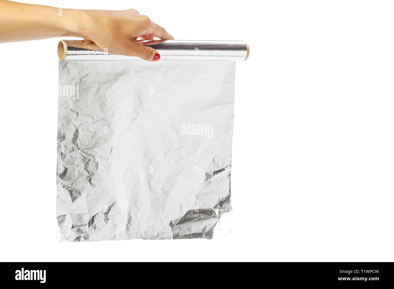 human hand holding a roll of foil on a white background Stock Photo - Alamy